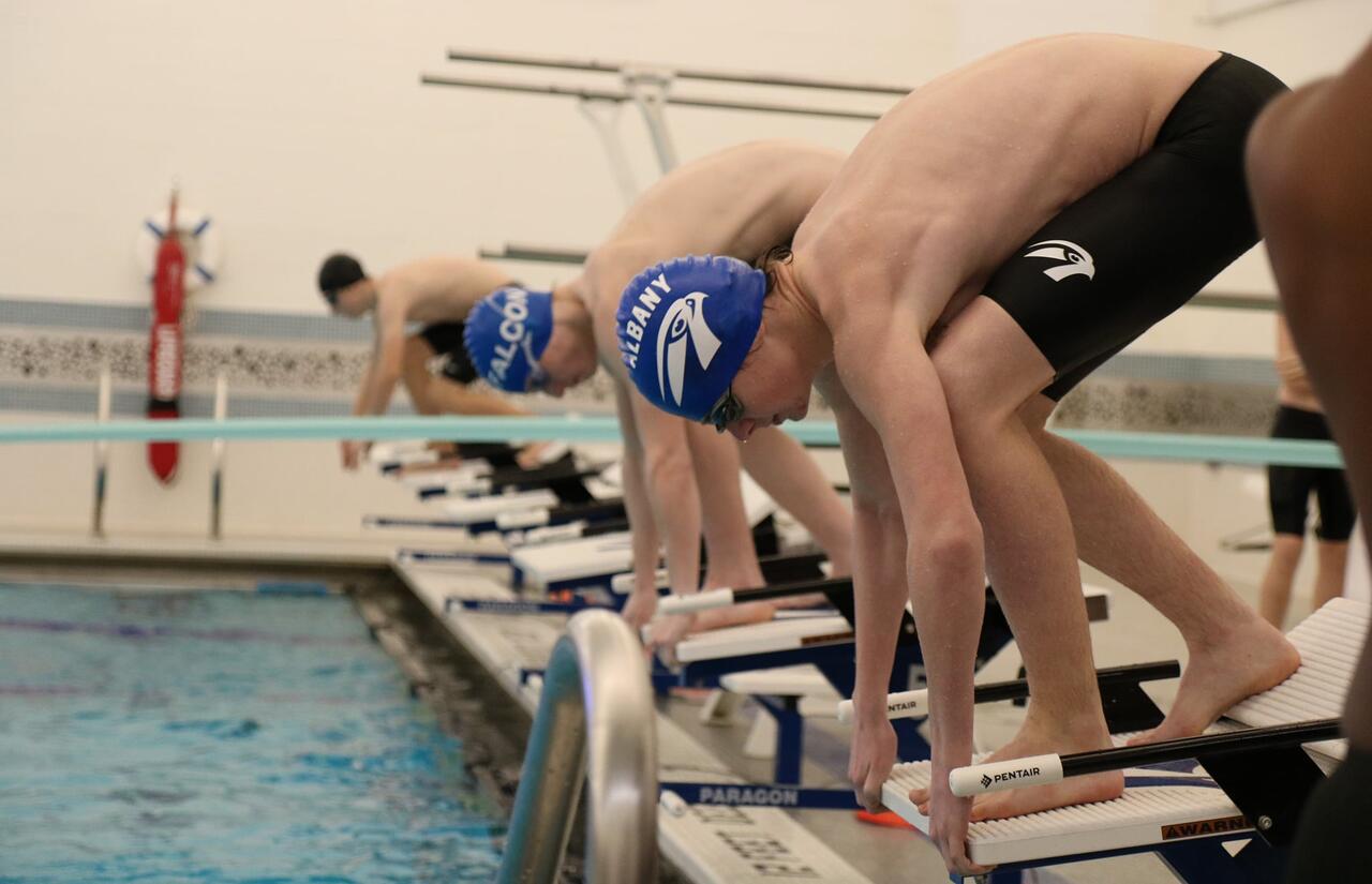 Boys' swim team races into post season | Athletics